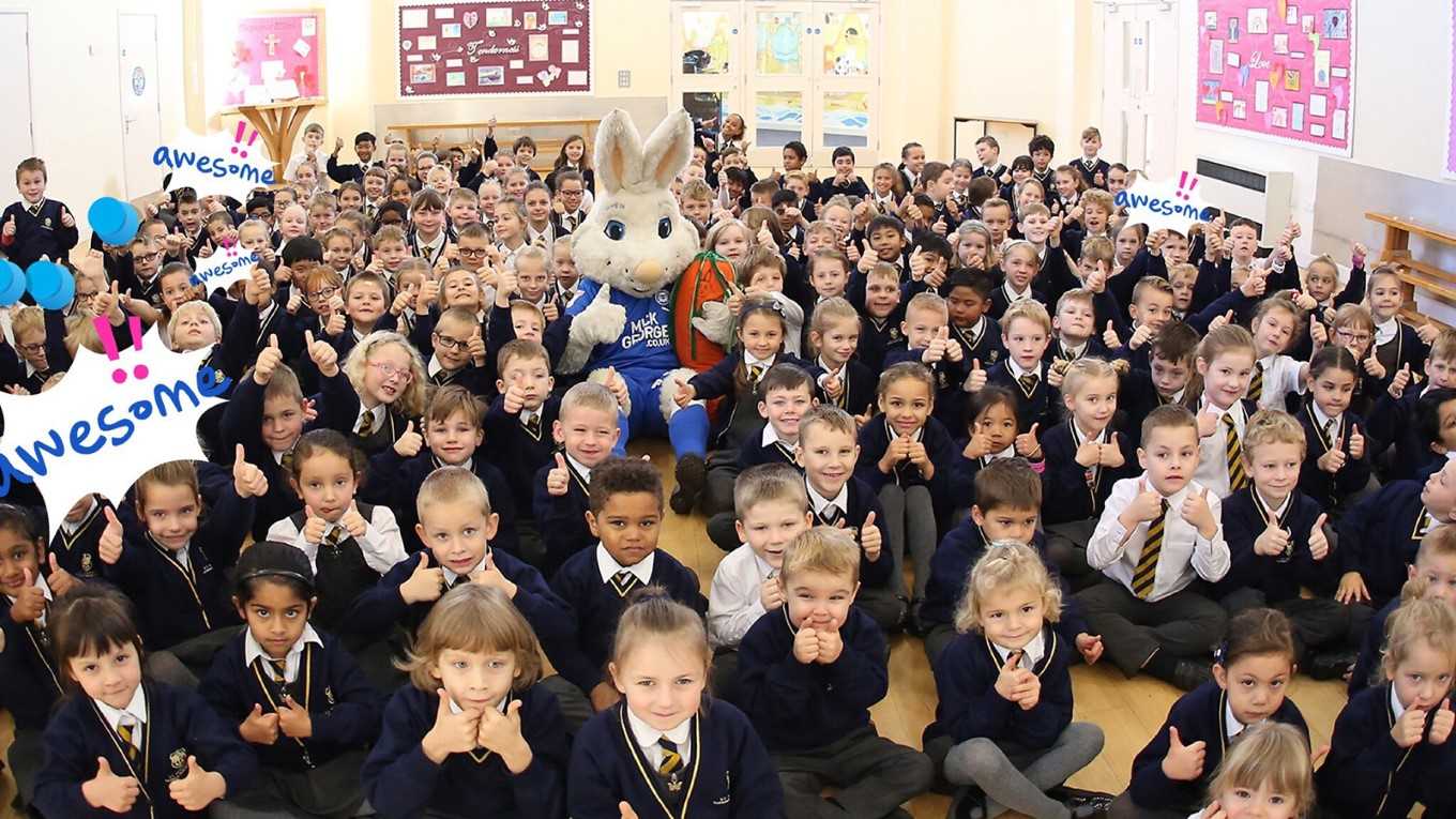 Posh’s Peter Burrow hops across the county border to visit children in ...